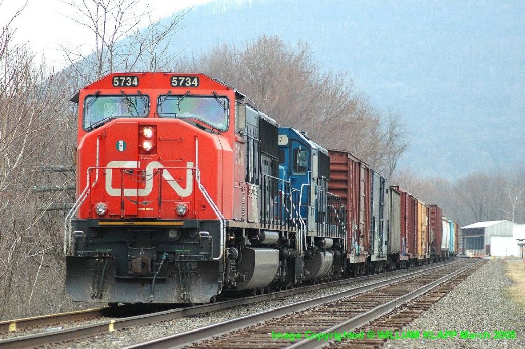 NS 30T CN 5734 ( SD75I ) On Siding At Herndon . With CSXT 8667